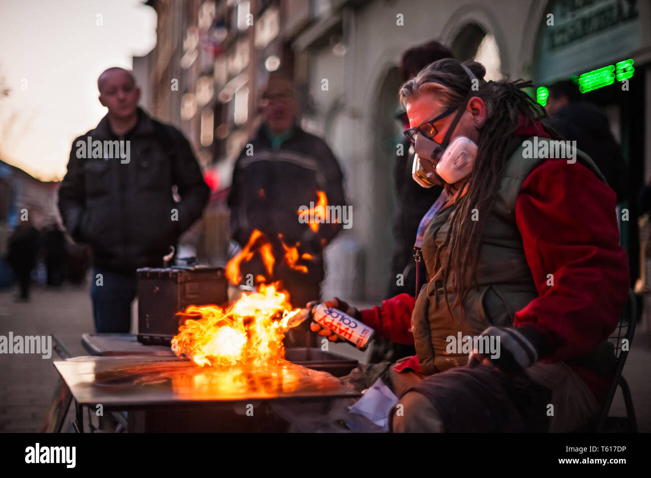 Spray paint artist finishing his piece of art Stock Photo - Alamy