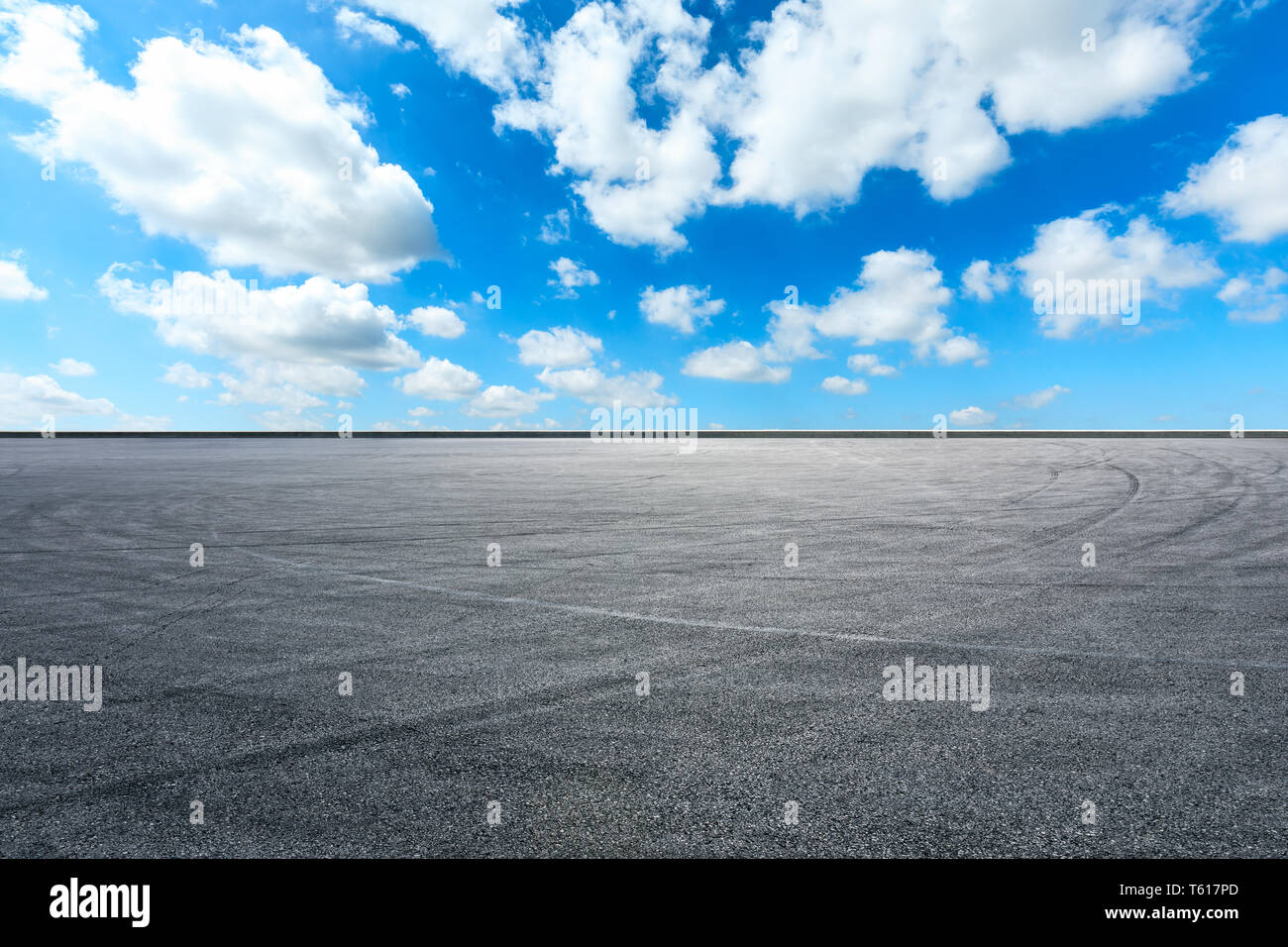 Empty asphalt race track ground and beautiful sky clouds Stock Photo ...