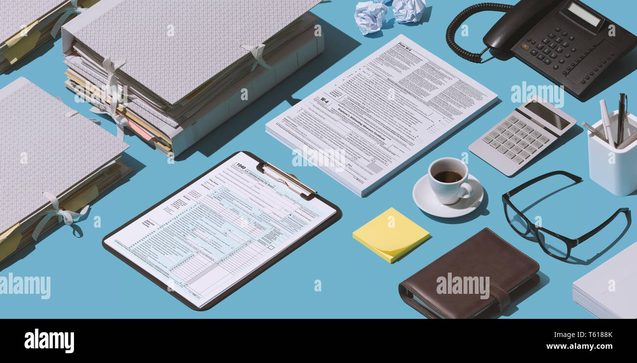Filing the 1040 individual income tax return form on the office desk ...
