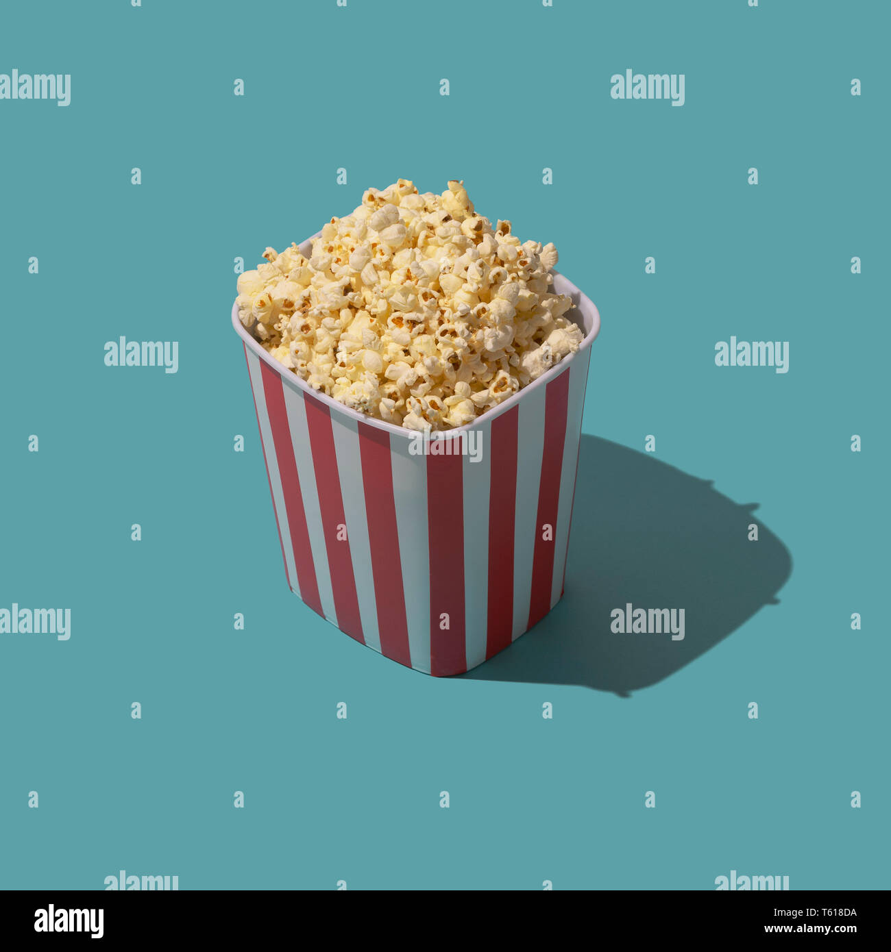 Delicious popcorn snack: fast food and cinema entertainment concept ...