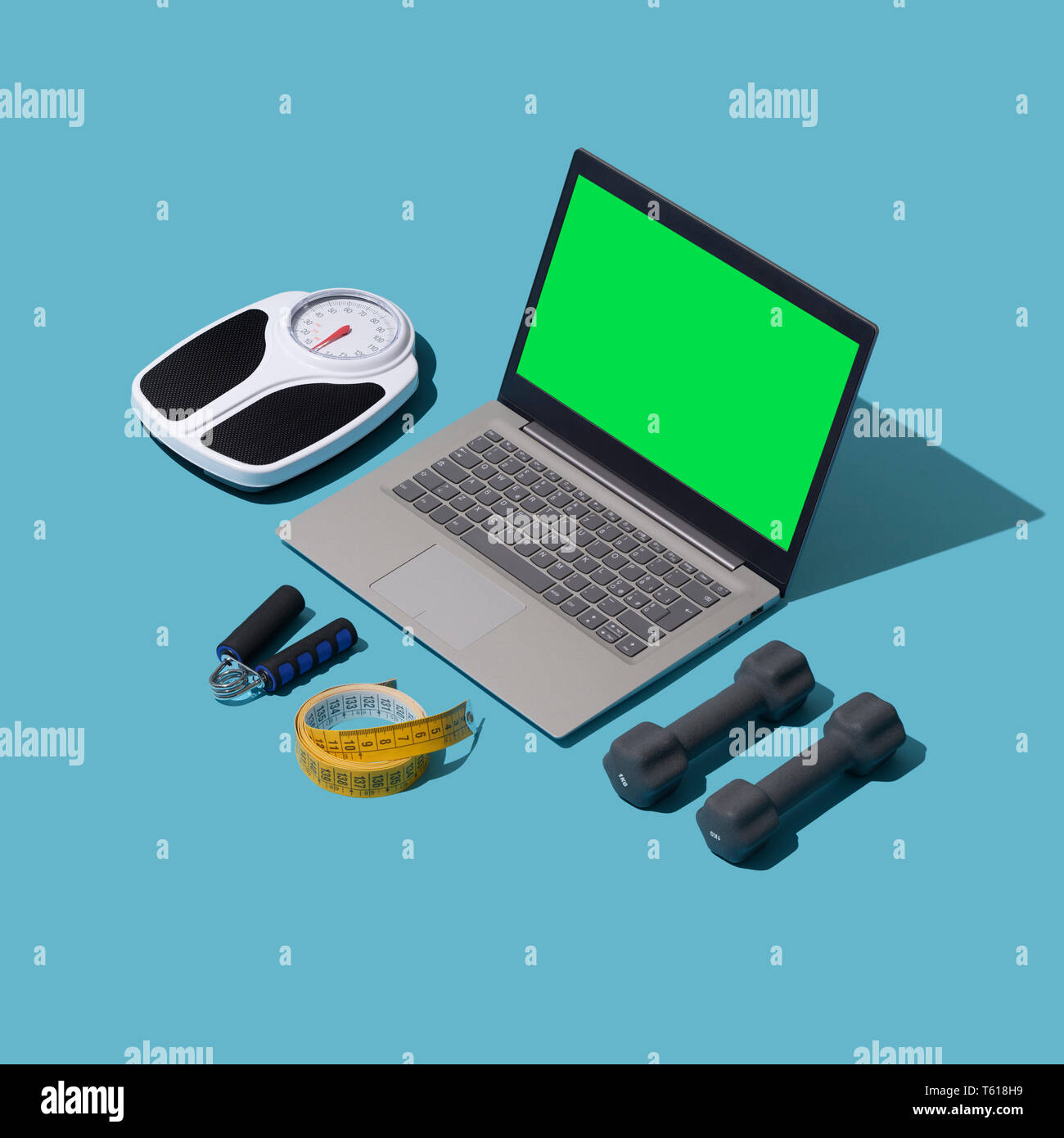 Laptop and sports equipment, fitness and technology concept Stock Photo ...
