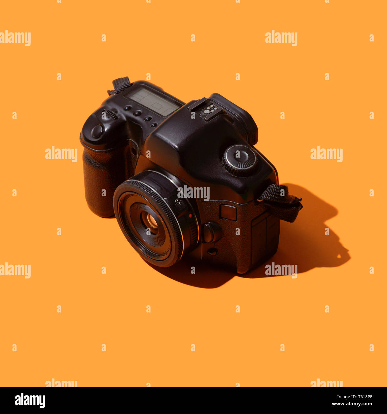 Professional digital reflex camera on yellow background, photography ...