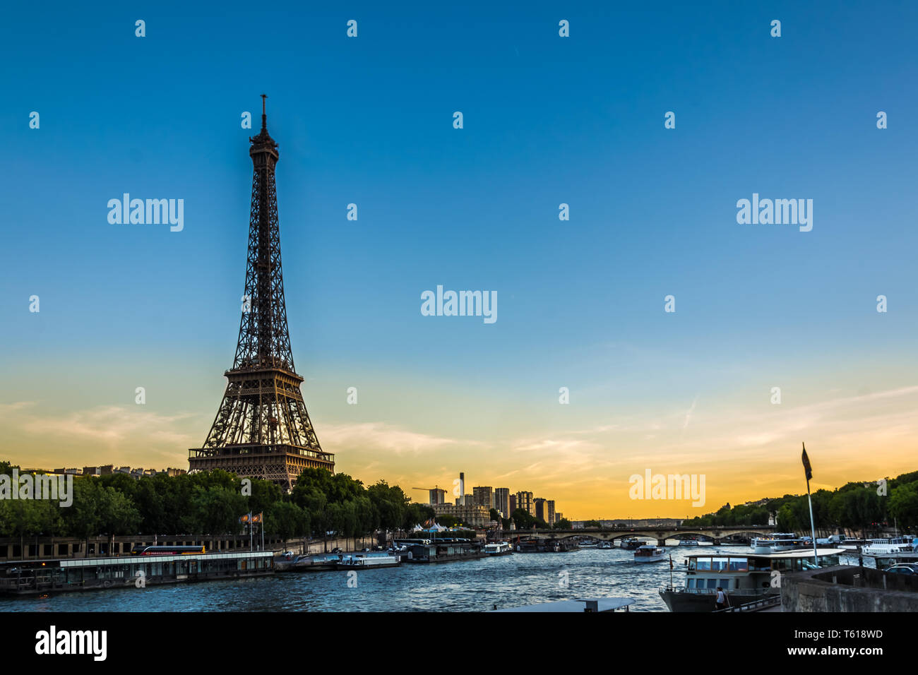 Sunset in Paris with a view on the Eiffel Tower and the Seine river ...