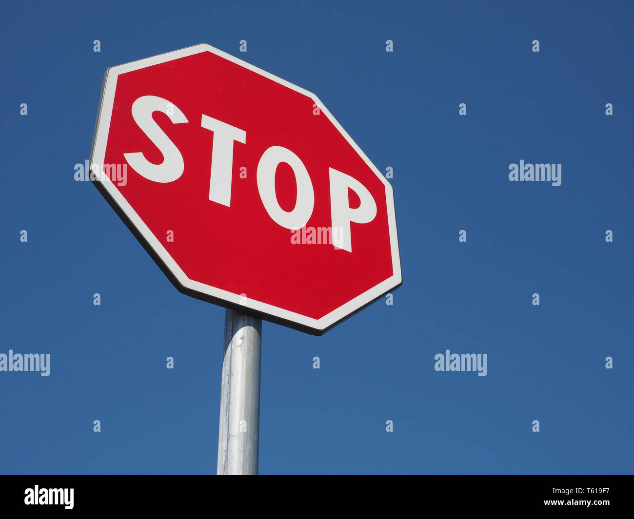 Warning signs, stop traffic sign over blue sky Stock Photo - Alamy