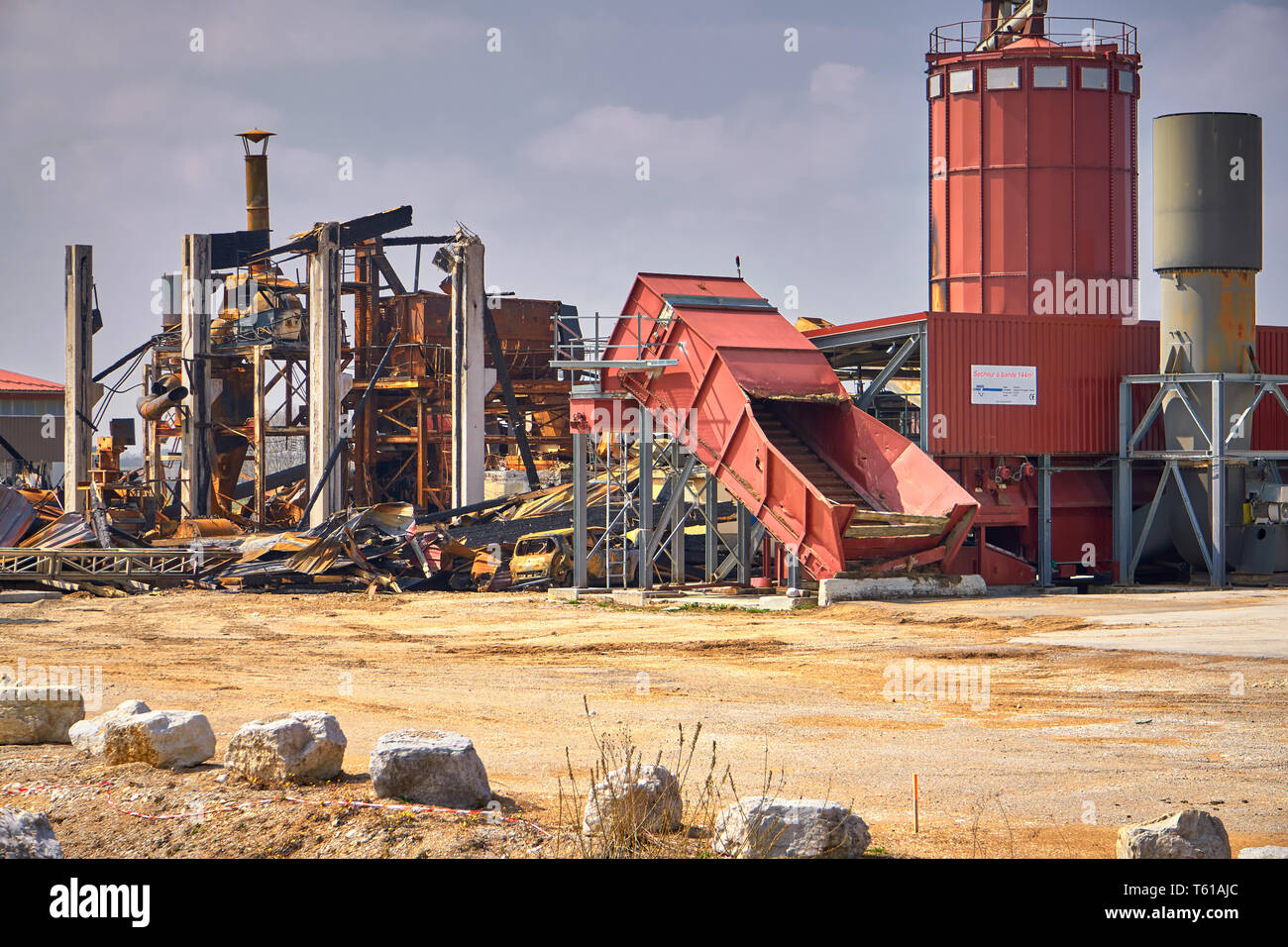 Machines and Burned Building Remains of a Sawmill Fire Stock Photo - Alamy
