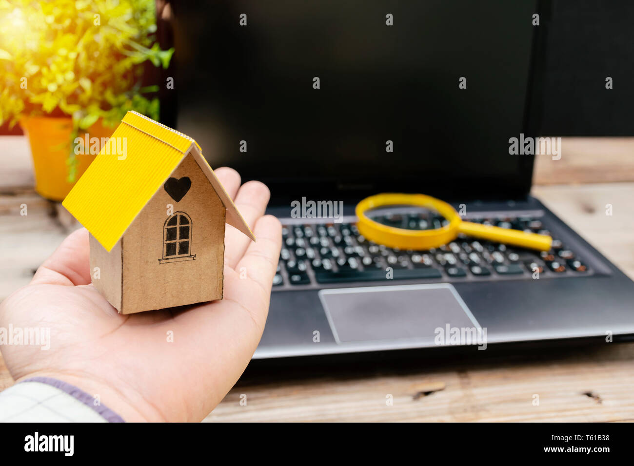 Searching for home concept. Model houses that are placed on hand and ...