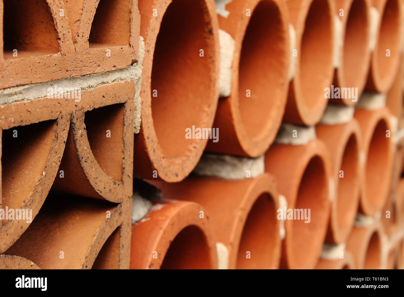 A red terra cotta brick and mortar fence Stock Photo - Alamy