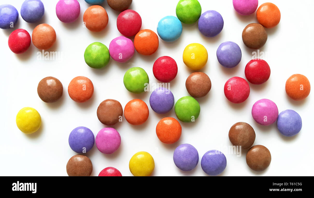 Bright color candy on white background Stock Photo - Alamy
