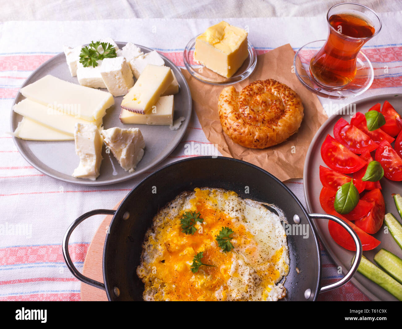 Traditional Turkish breakfast - fried eggs, fresh vegetables, cheese ...