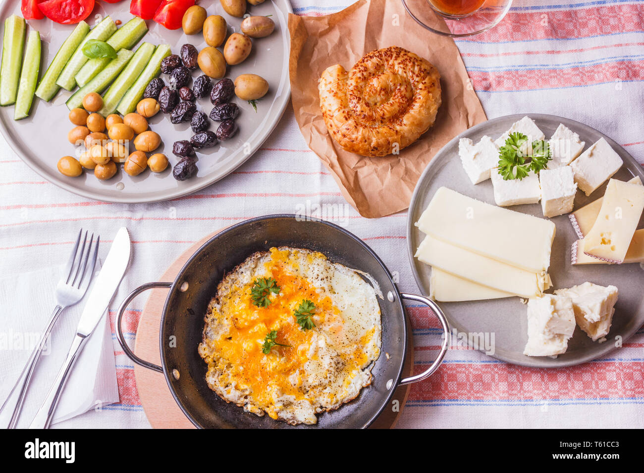 Traditional Turkish breakfast - fried eggs, fresh vegetables, cheese ...