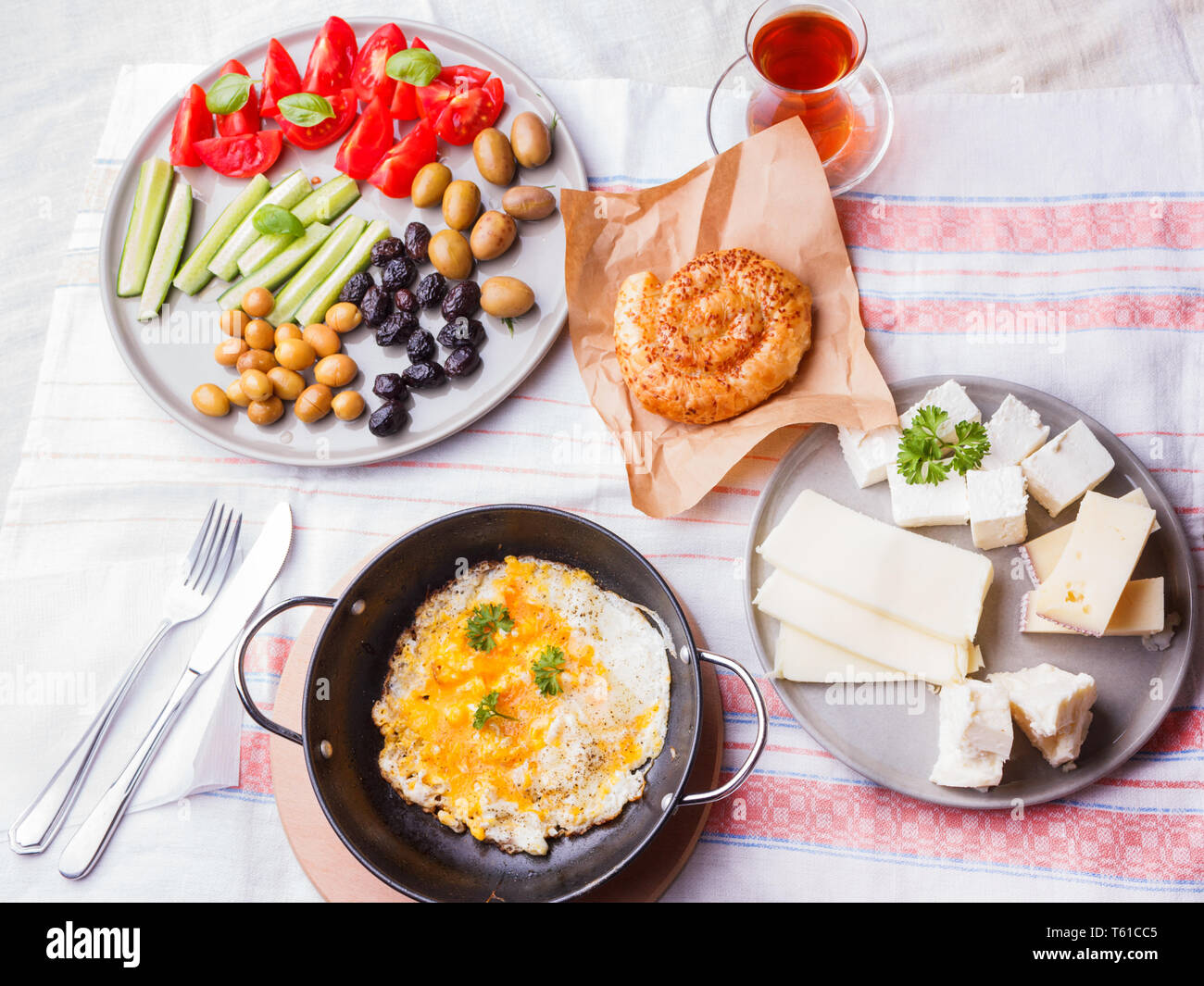 Traditional Turkish breakfast - fried eggs, fresh vegetables, cheese ...