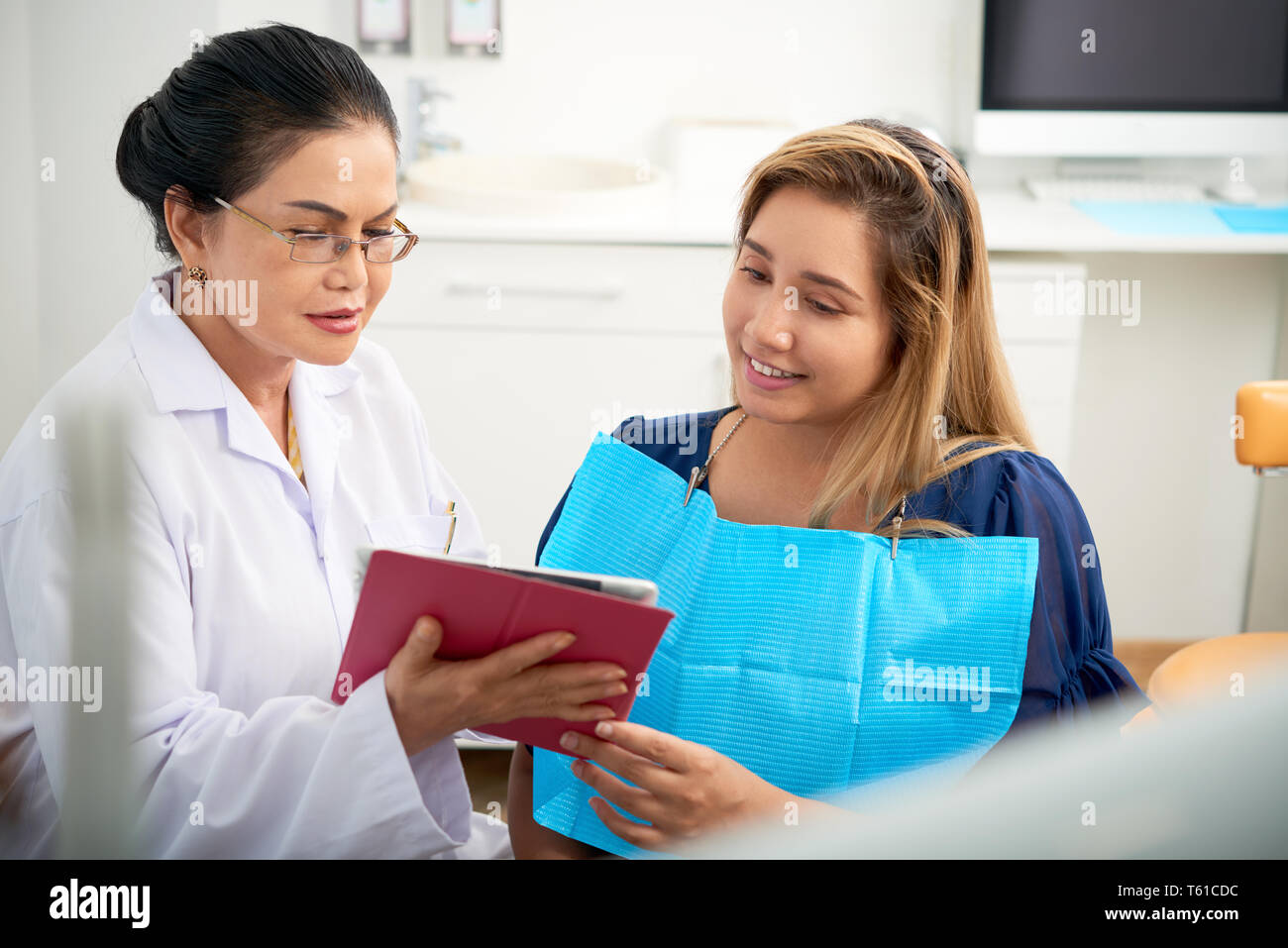 Dentist reading prescription Stock Photo - Alamy