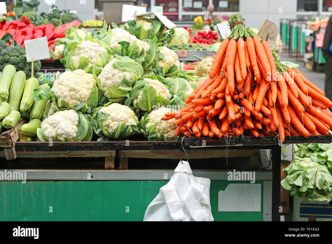 Fresh organic vegetables piles sold on market stall Stock Photo - Alamy