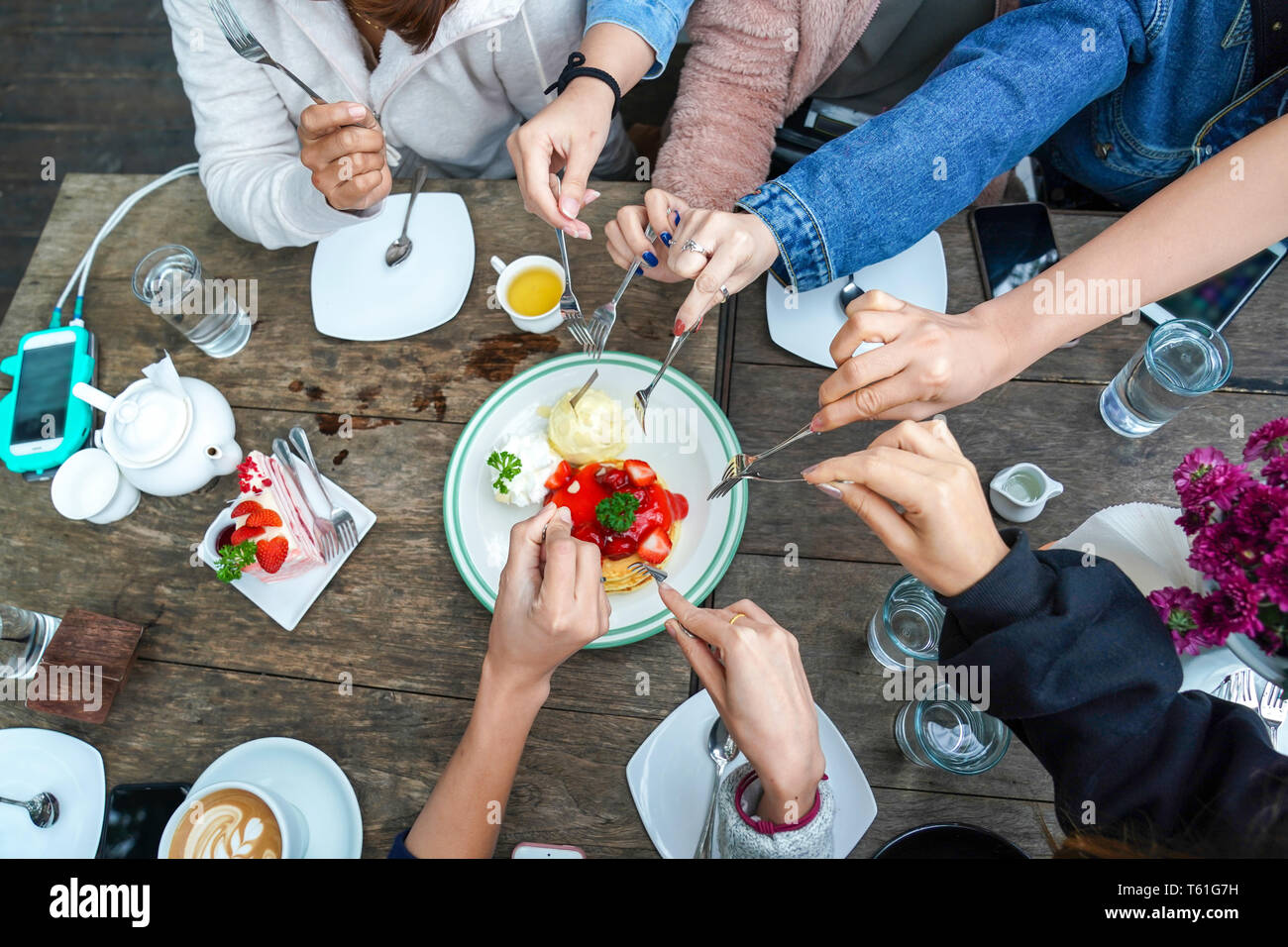 top view women and friends dessert party together, eating strawberry ...