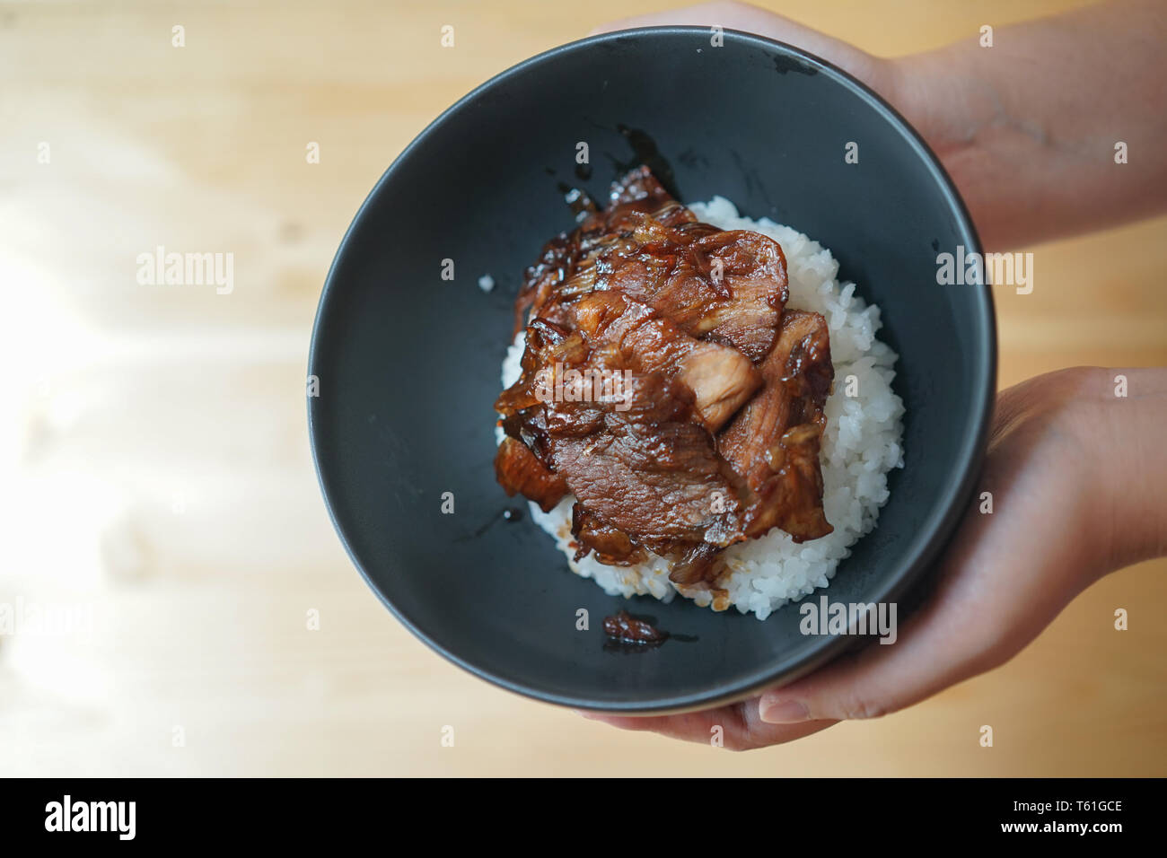 Grilled meat on the Japanese rice with wood table background Stock ...