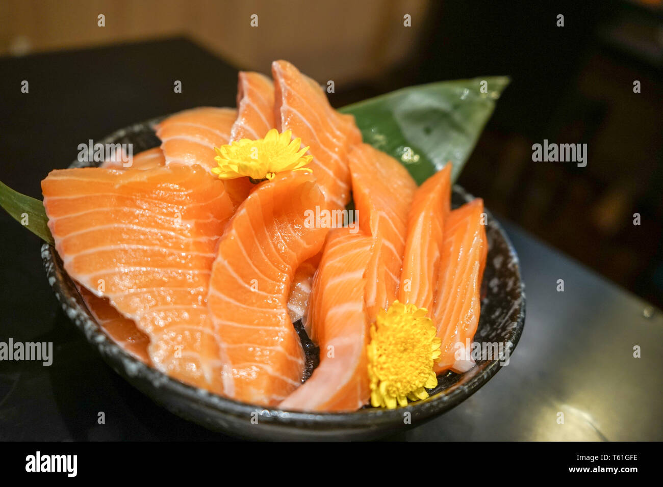 salmon sashimi buffet in the Japanese restaurant Stock Photo - Alamy