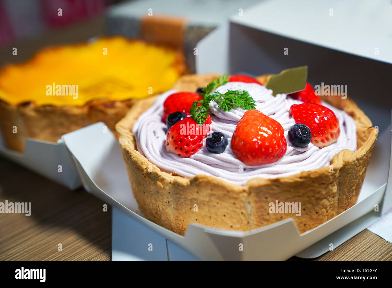 Cool fresh Fruity berry cheese tart; blueberry cream favour topping ...