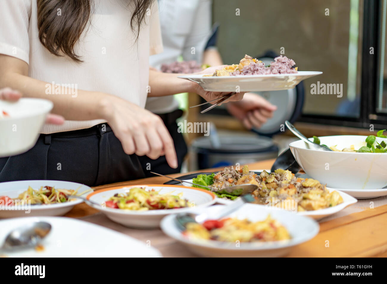 Hands woman scooping soup plate hi-res stock photography and images - Alamy