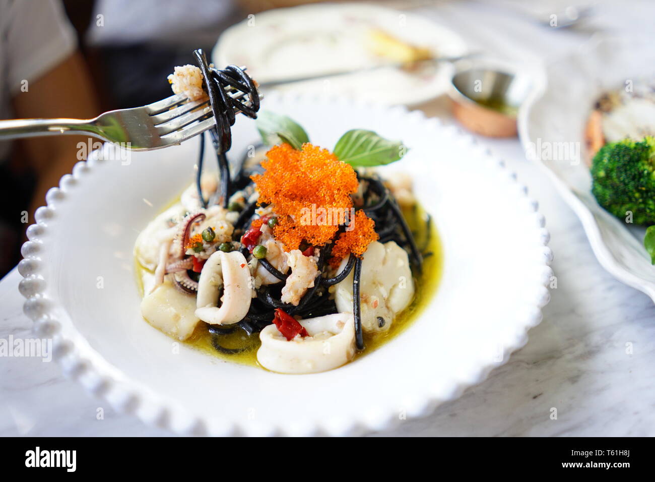 squid spaghetti black noodle with fish roe; tobiko / ebiko on top Stock ...