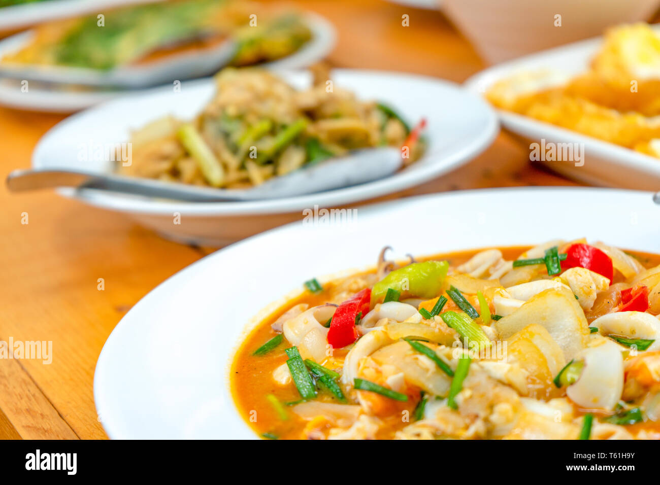 Stir-Fried Squid with Salted Duck Eggs (bplaa meuk phat khai khem), a ...