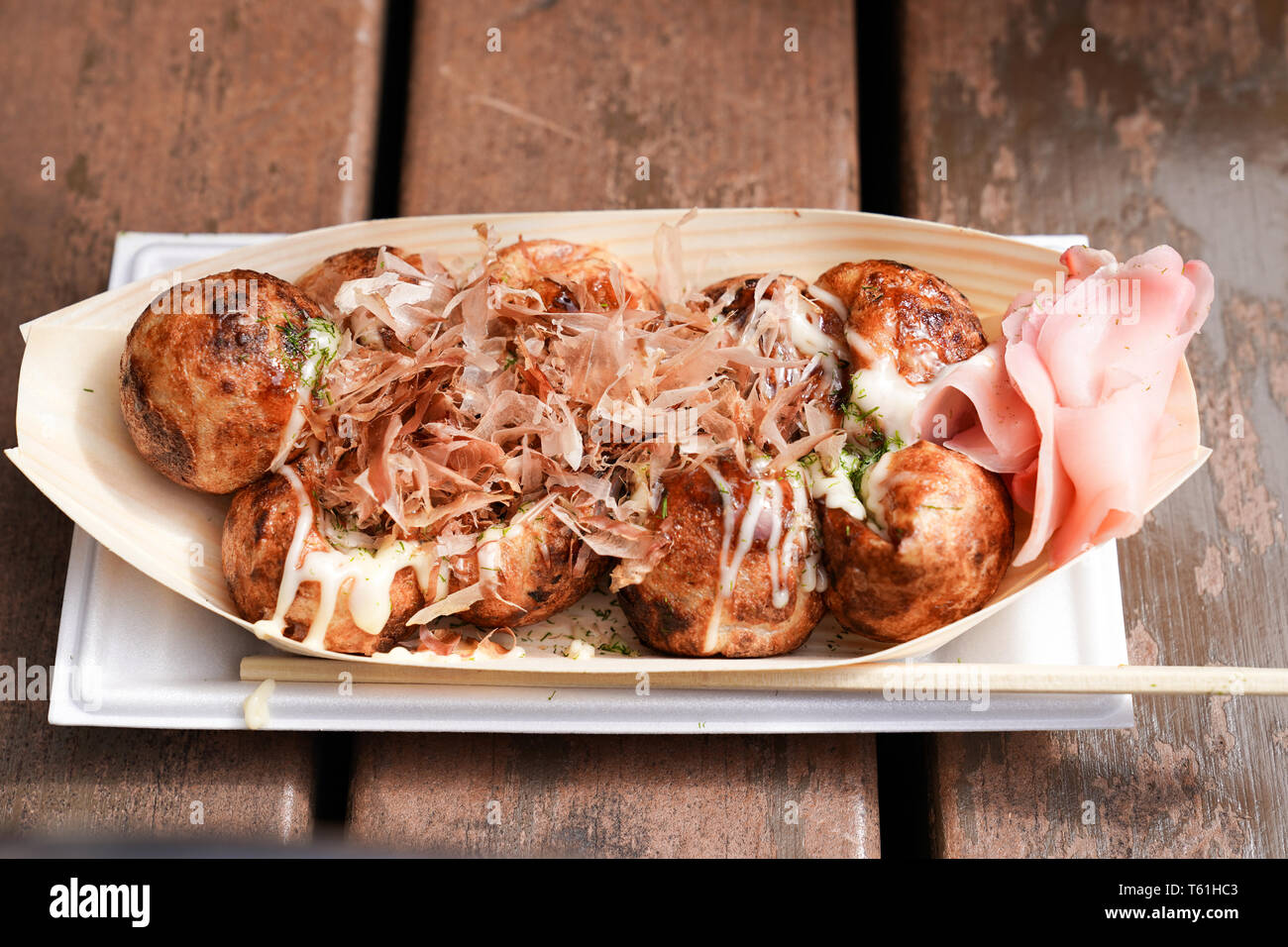 Takoyaki, Local Japanese octopus meat ball on the wood table, ready to ...