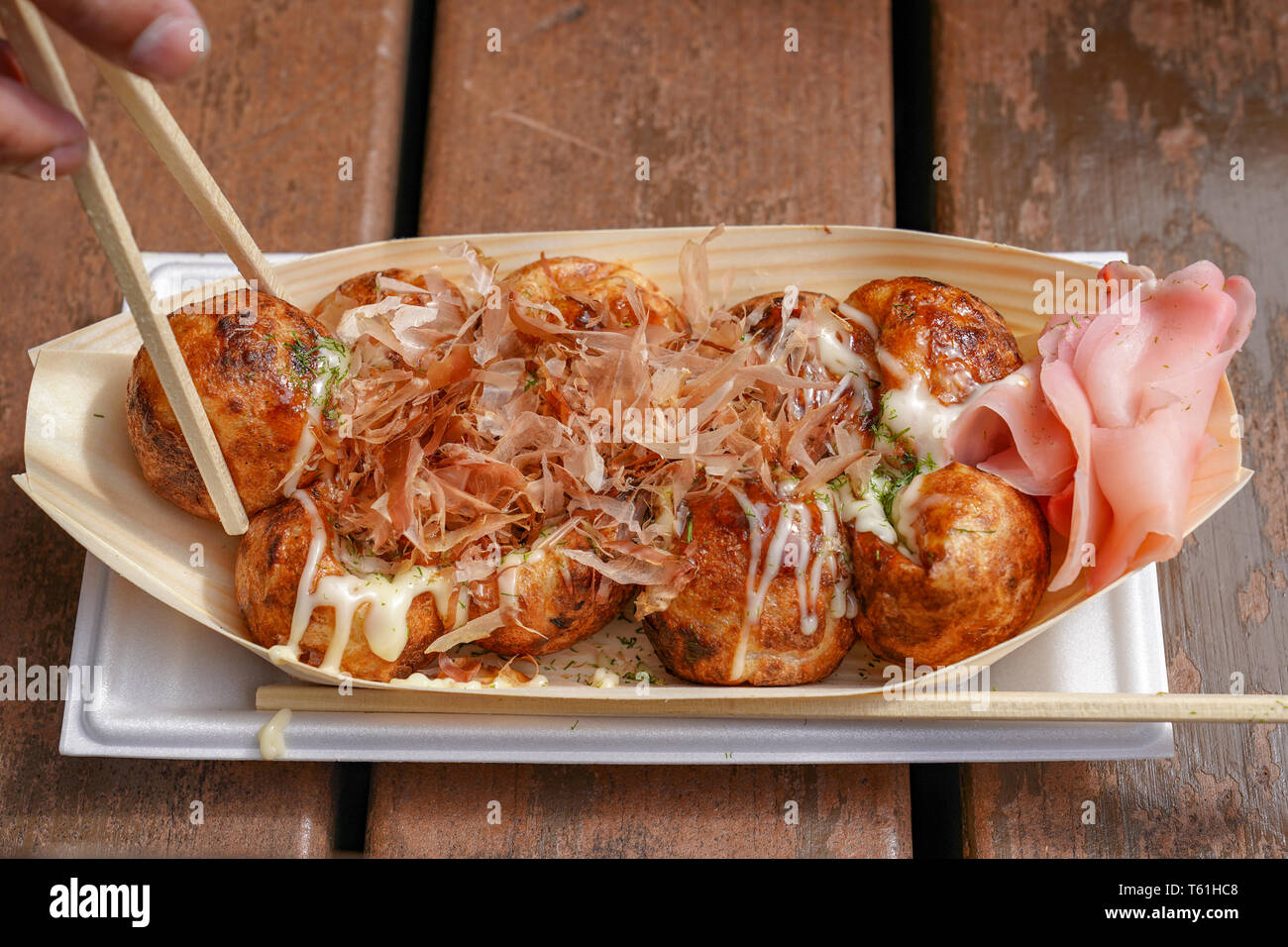 Takoyaki, Local Japanese octopus meat ball on the wood table, ready to ...