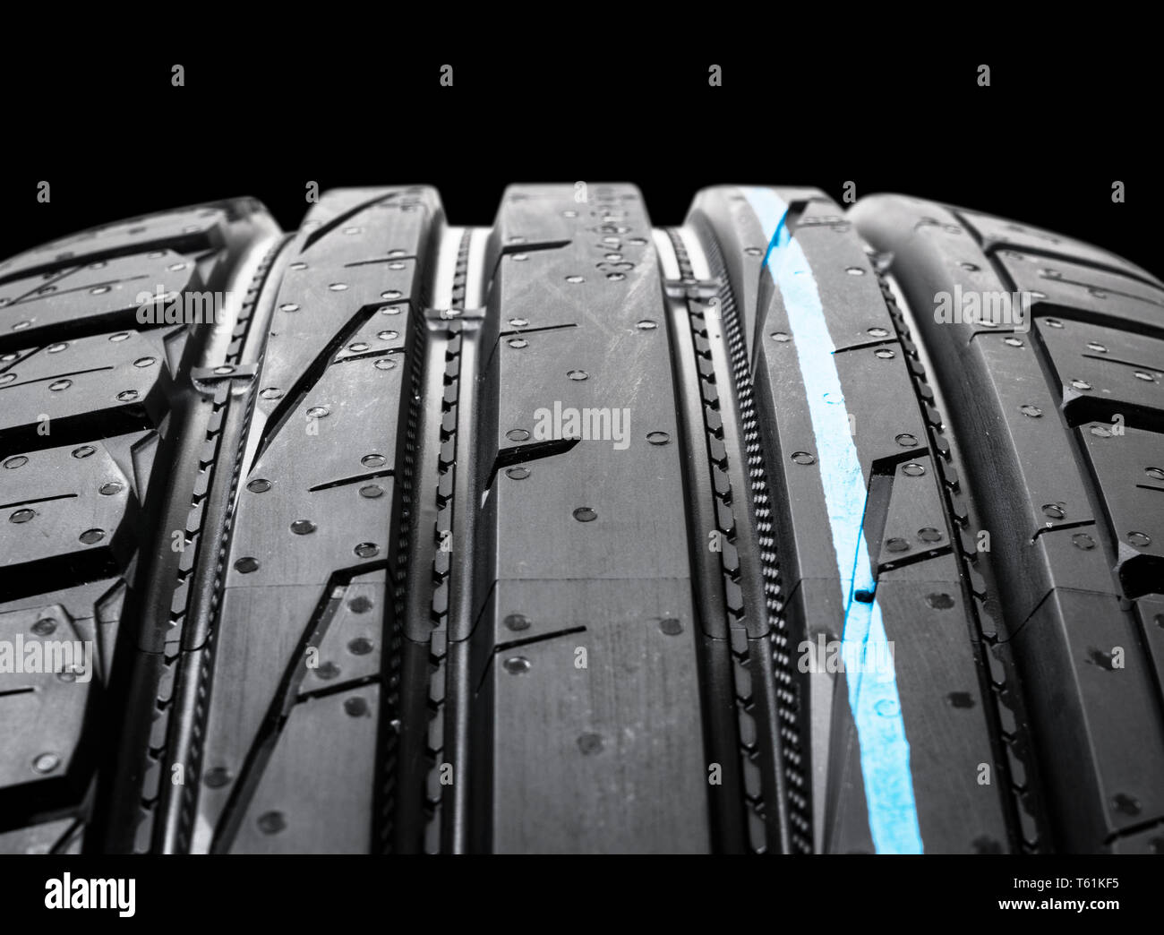 Car tire isolated on black background. Tire stack. Car tyre protector ...