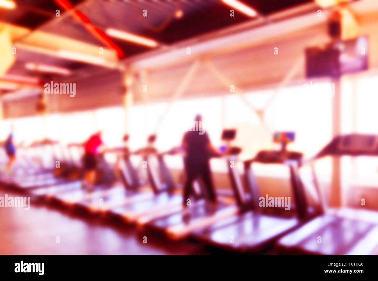 Blurred background with fitness gym people cardio workout in sport club ...
