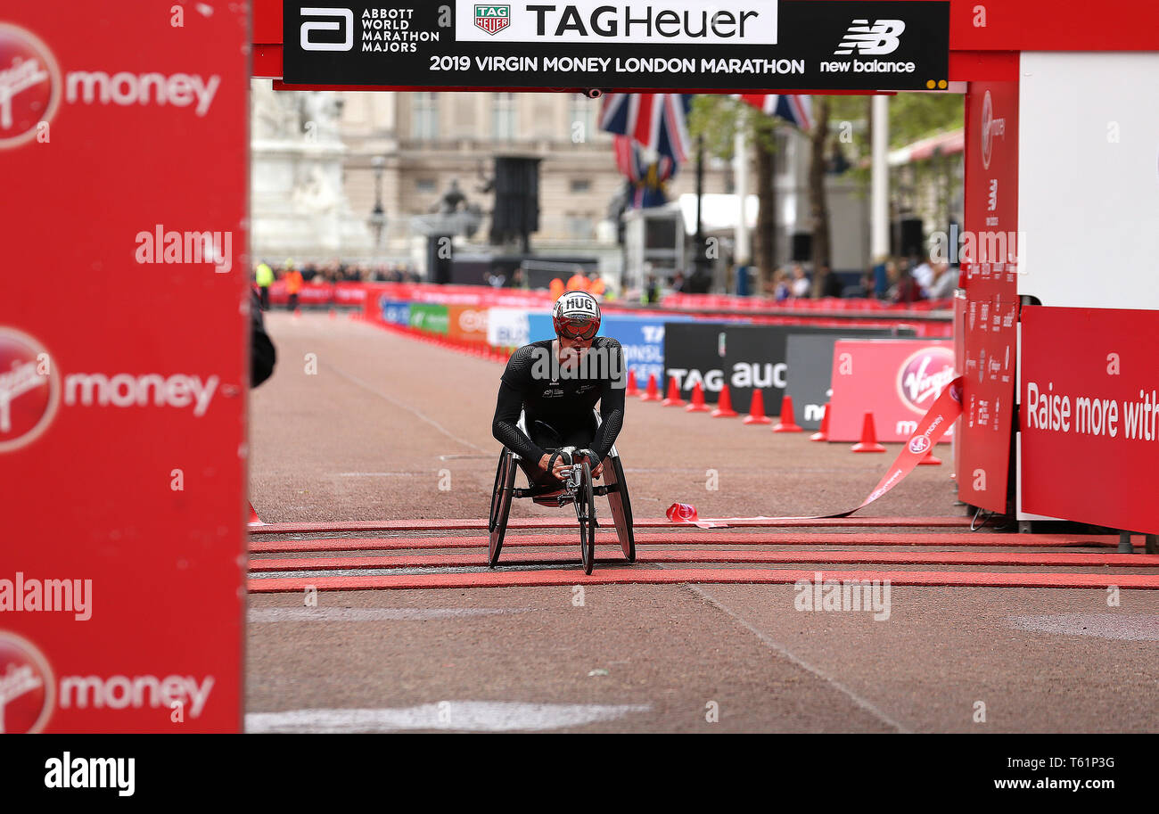 Marcel Hug finishes second in the Men's Wheelchair Marathon during the ...