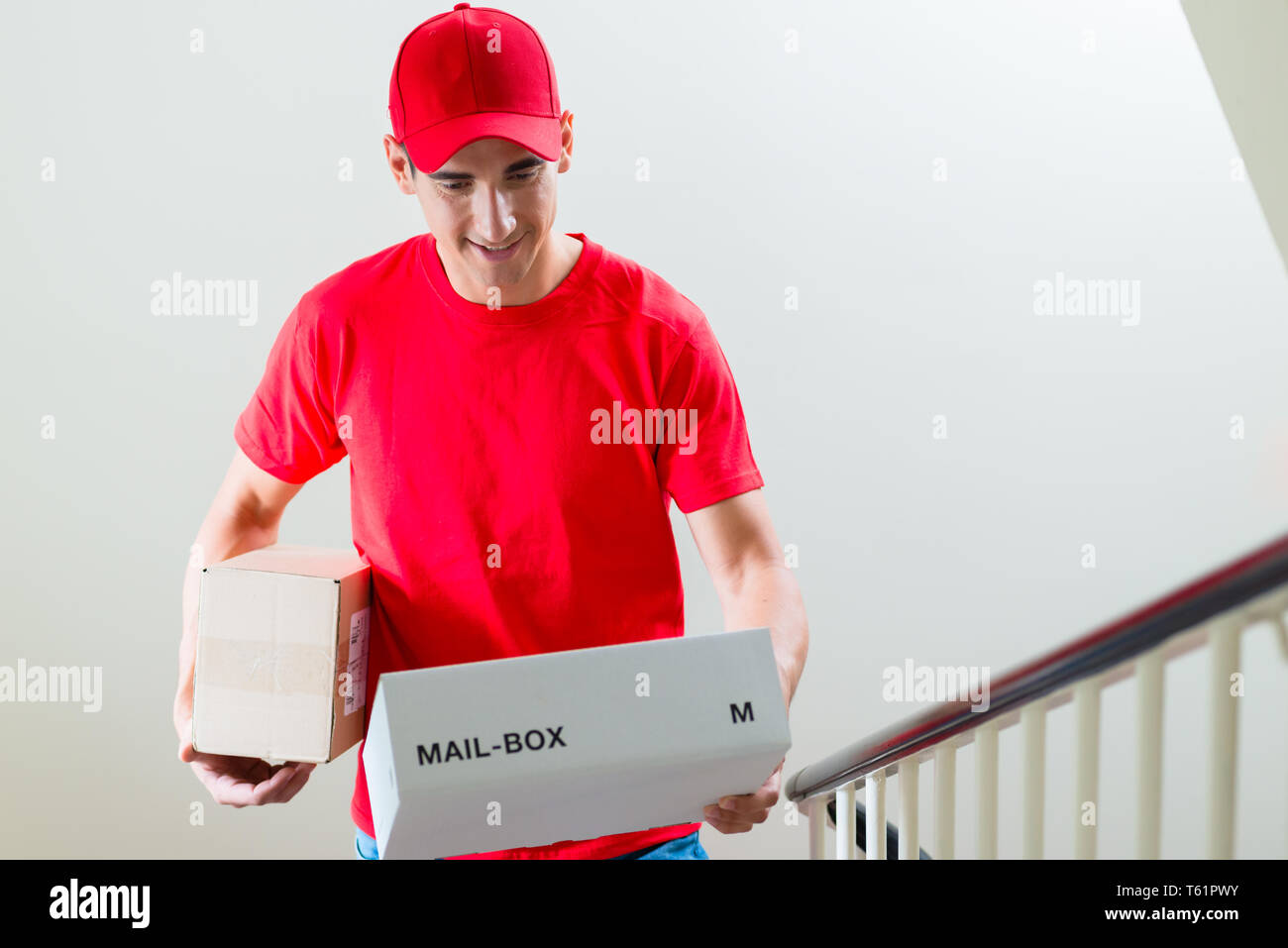Man carrying boxes stairs hi-res stock photography and images - Alamy