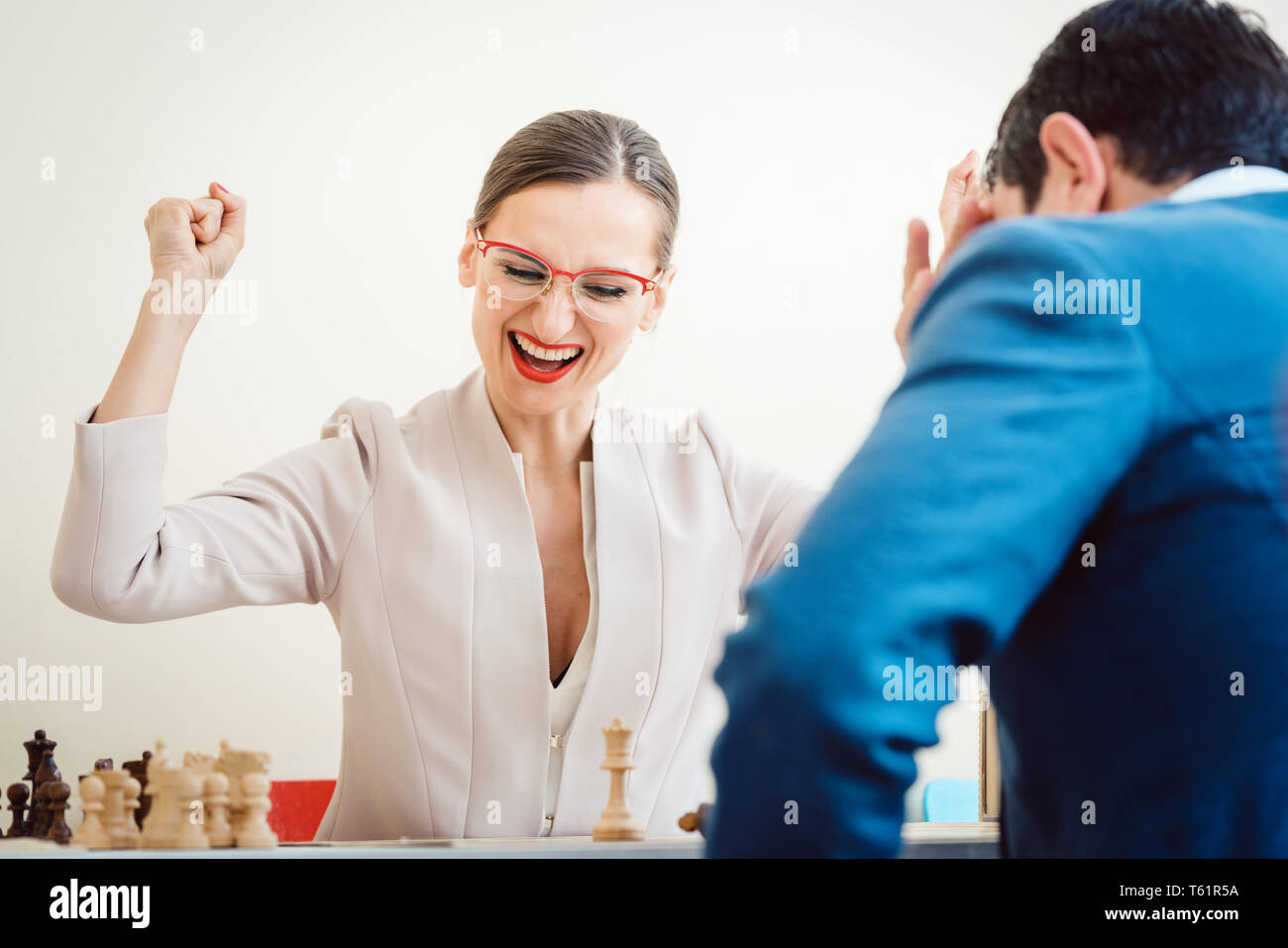 Businesswoman winning in chess due to better strategy Stock Photo - Alamy