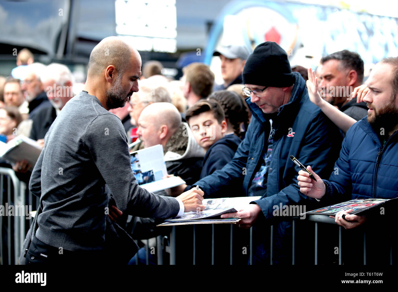 Manchester City manager Pep Guardiola signs autographs for fans ahead ...