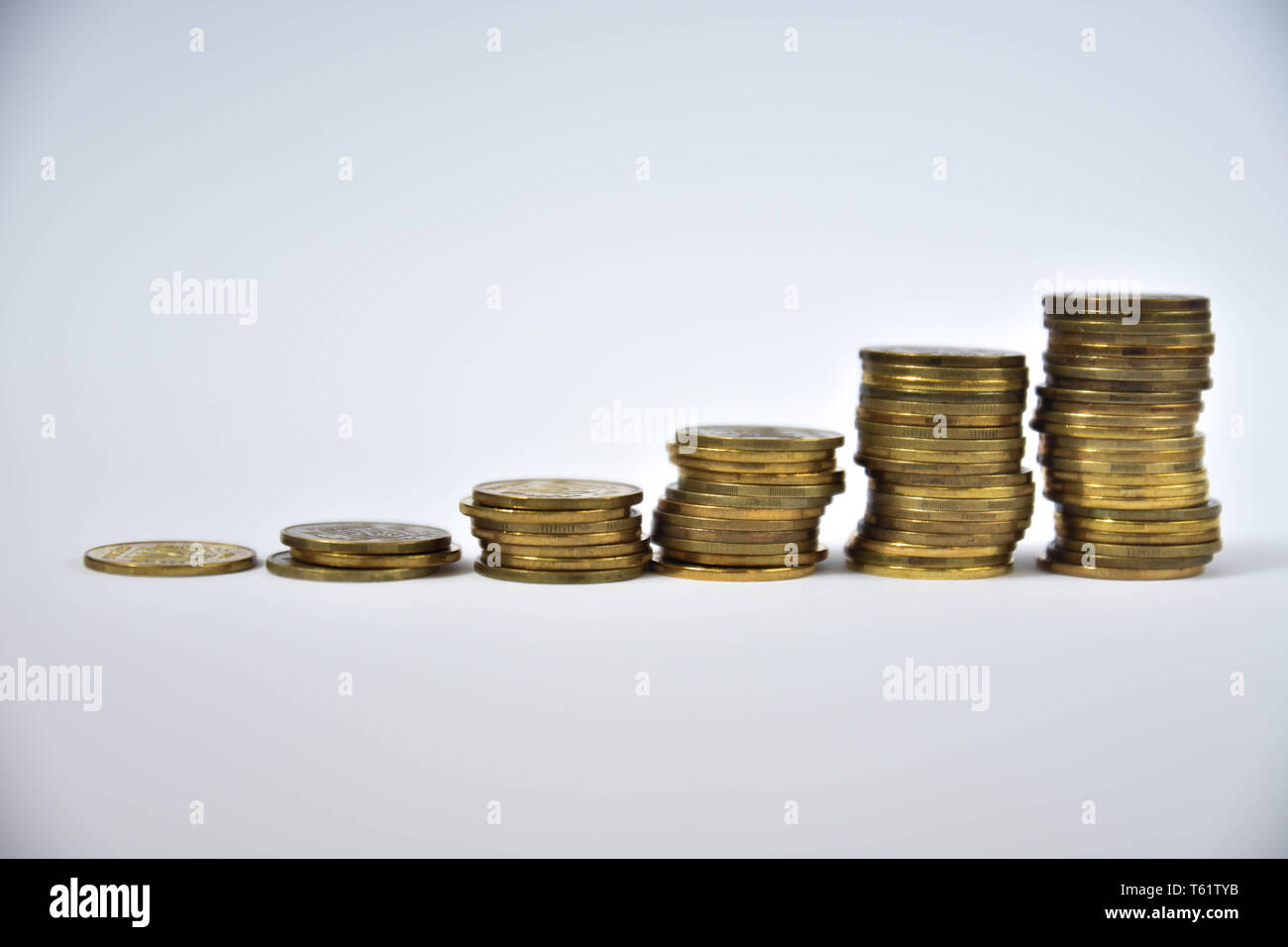 Diagonal diagram from pennies on white background Stock Photo - Alamy
