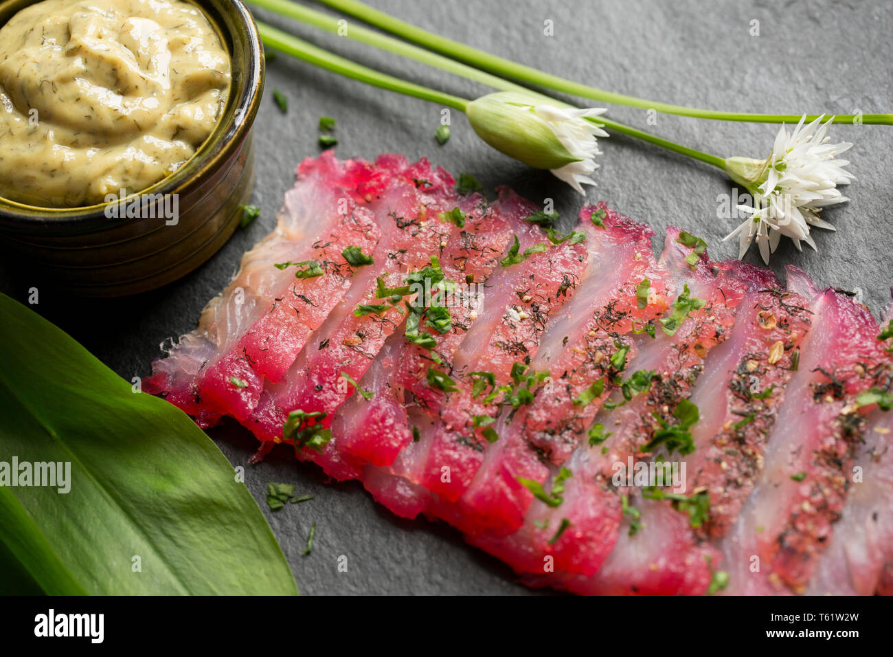 Sliced pollack gravadlax, or gravlax, from a fillet of pollack ...