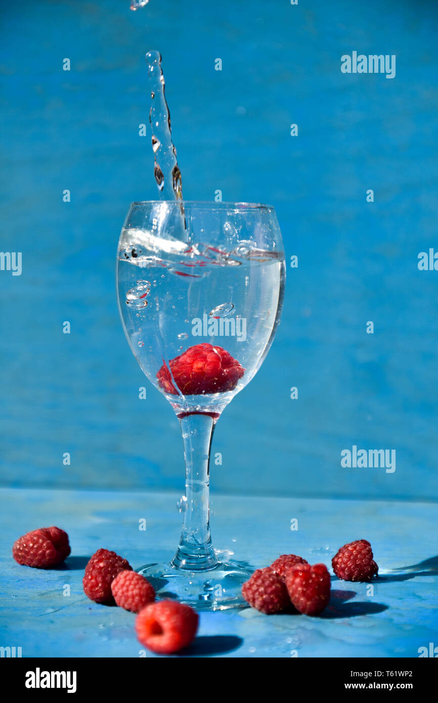 Close up red raspberry falling hi-res stock photography and images - Alamy