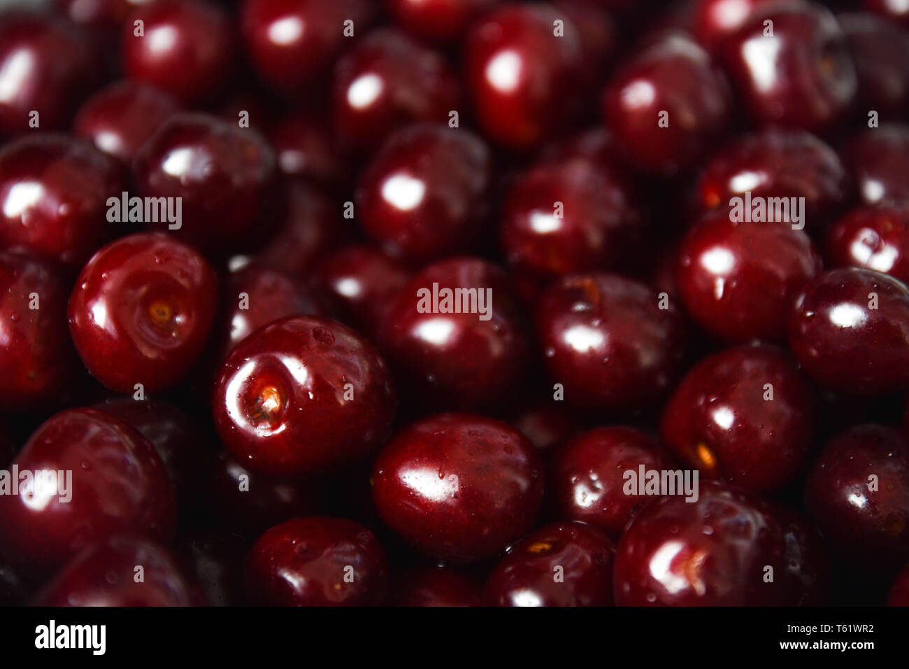 Sweet cherry background Stock Photo - Alamy
