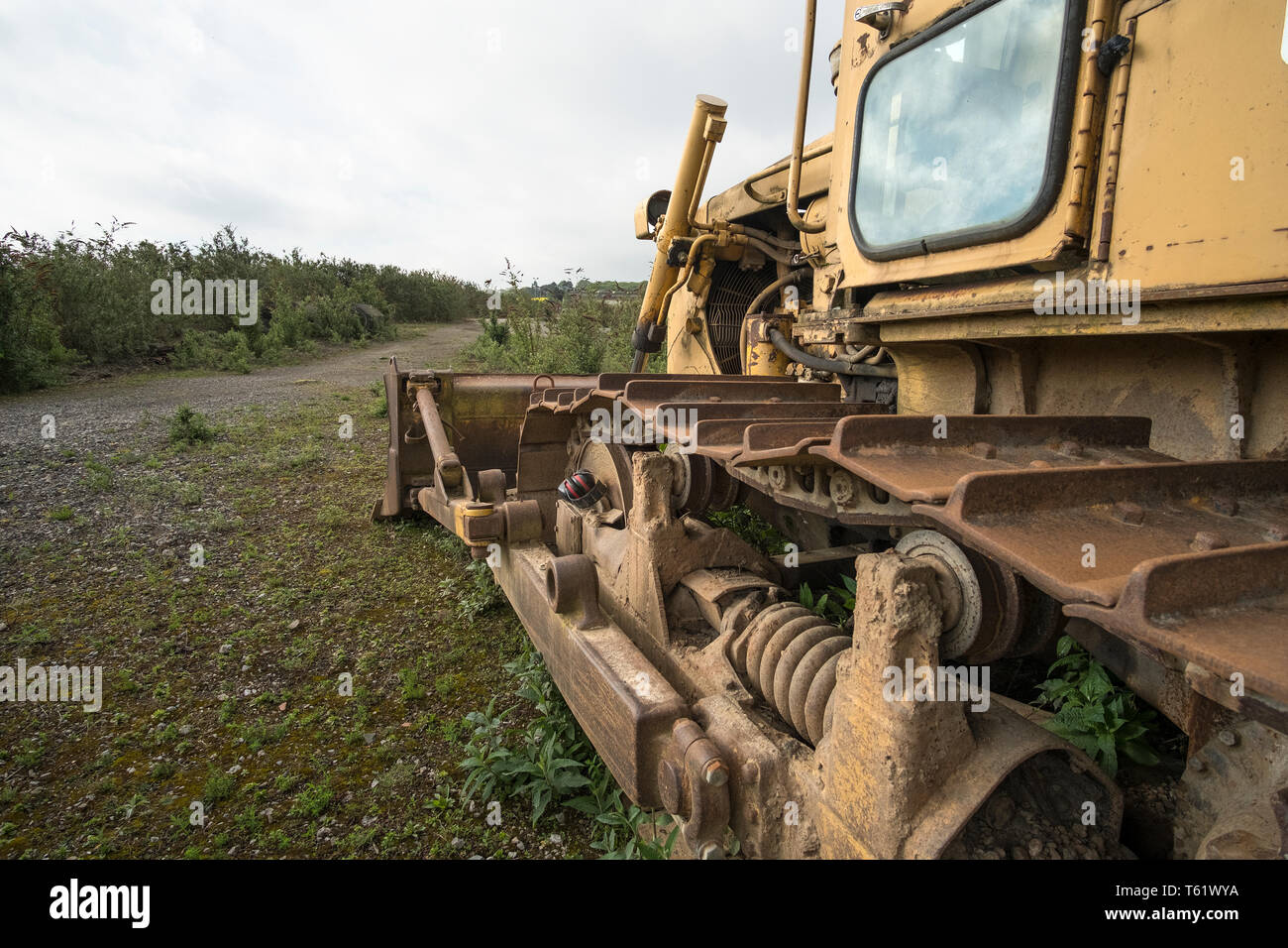 Rusty yellow bulldozer forward view Stock Photo - Alamy