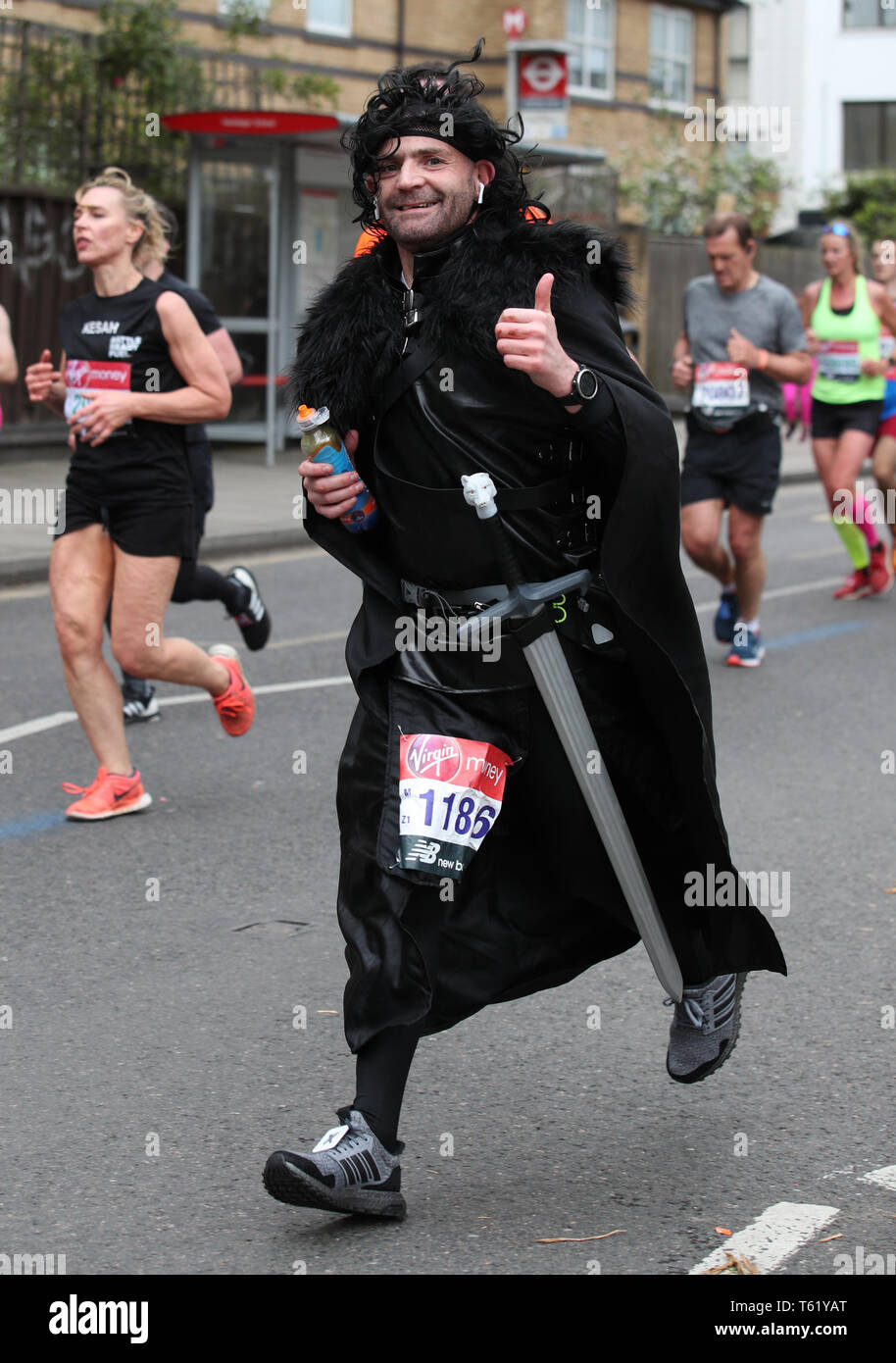 A runner dressed as the character Jon Snow from Game of Thrones during ...