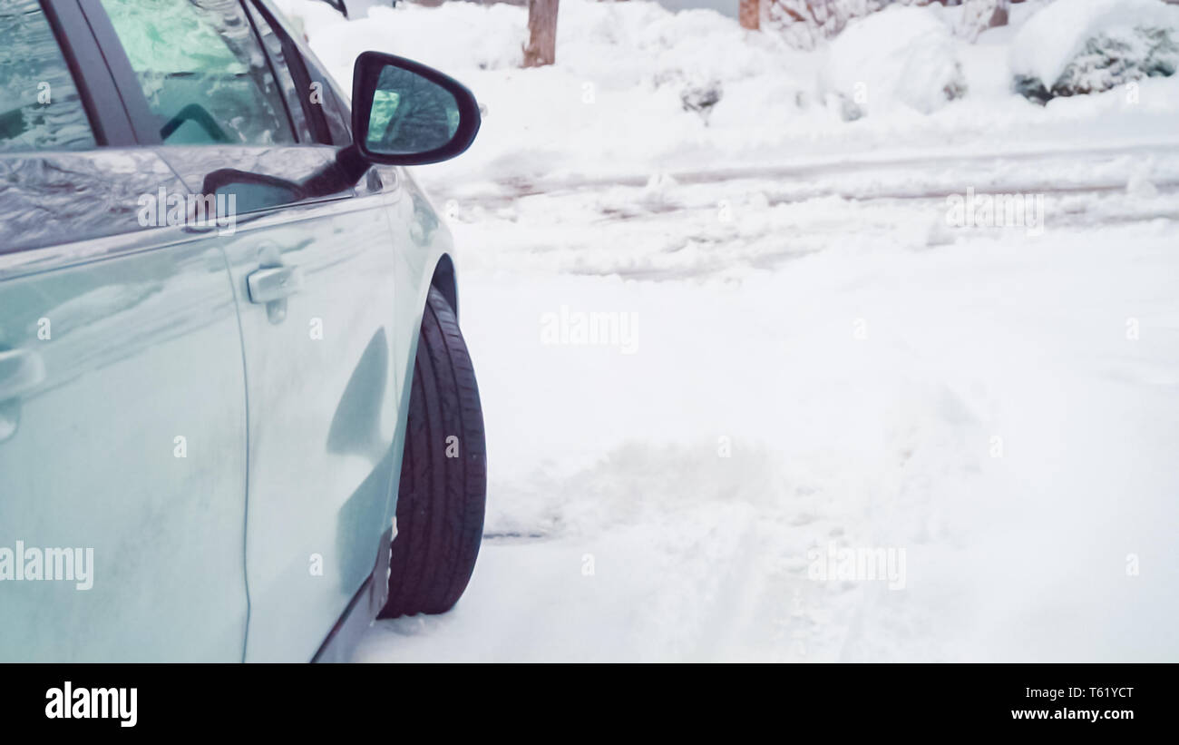 Passenger car in deep snow on small street Stock Photo - Alamy