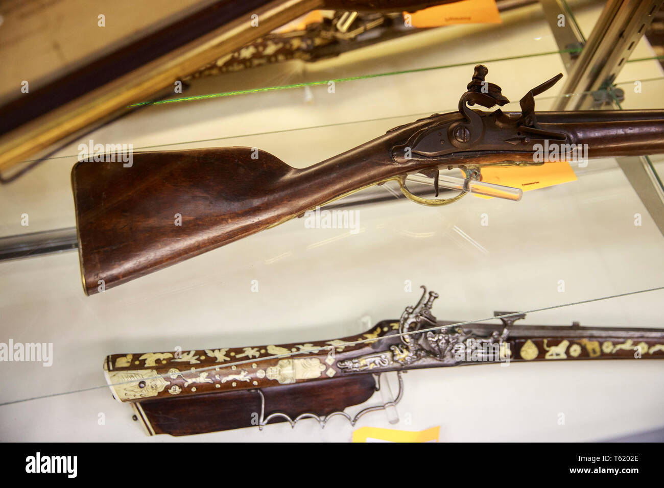 A Dutch Type III musket made between 1750 and 1770, top, which fired ...
