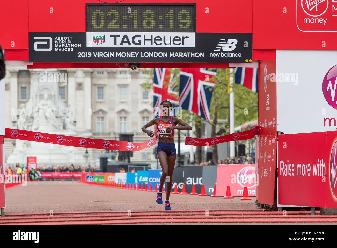 London, UK. 28th Apr, 2019. Kenya's Brigid Kosgei runs through the finish line during the 2019 ...