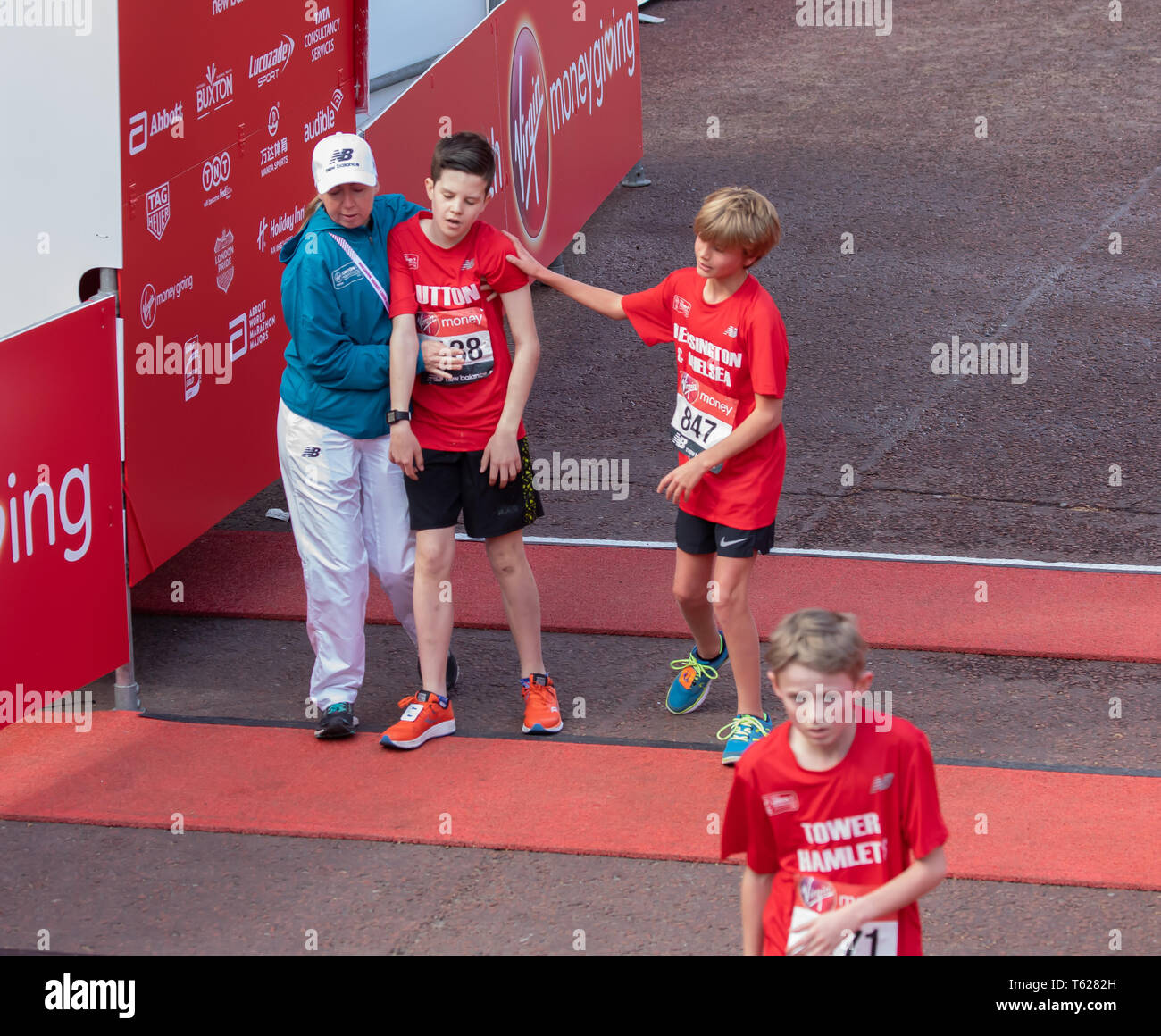 London, UK. 28th April 2019, Children cross the Finish Line of The 39th ...