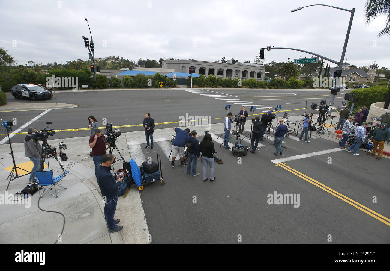 Poway, California, USA. 28th Apr, 2019. News media report from across ...