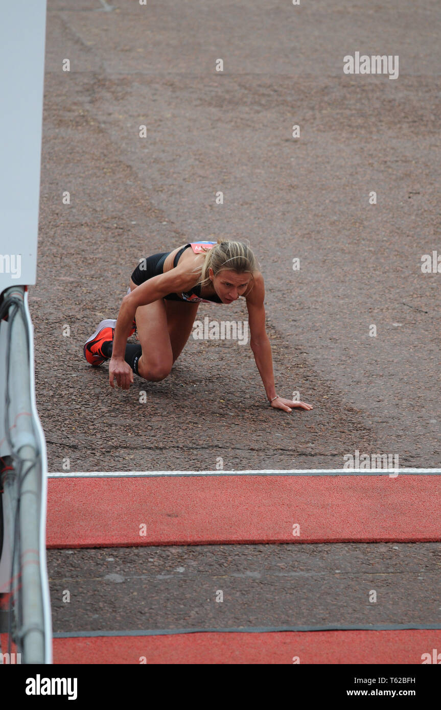 Runner reaching finish line hi-res stock photography and images - Alamy