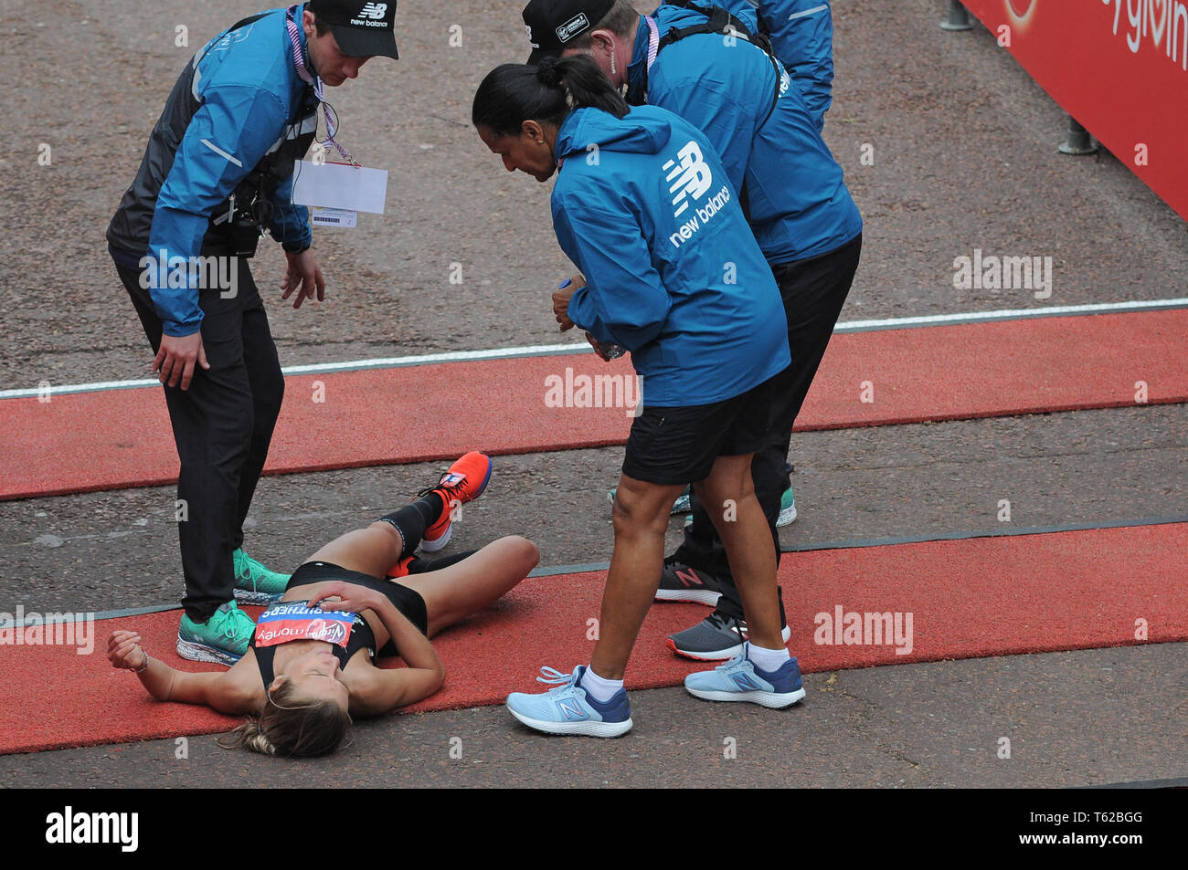 Woman collapsing marathon hi-res stock photography and images - Alamy