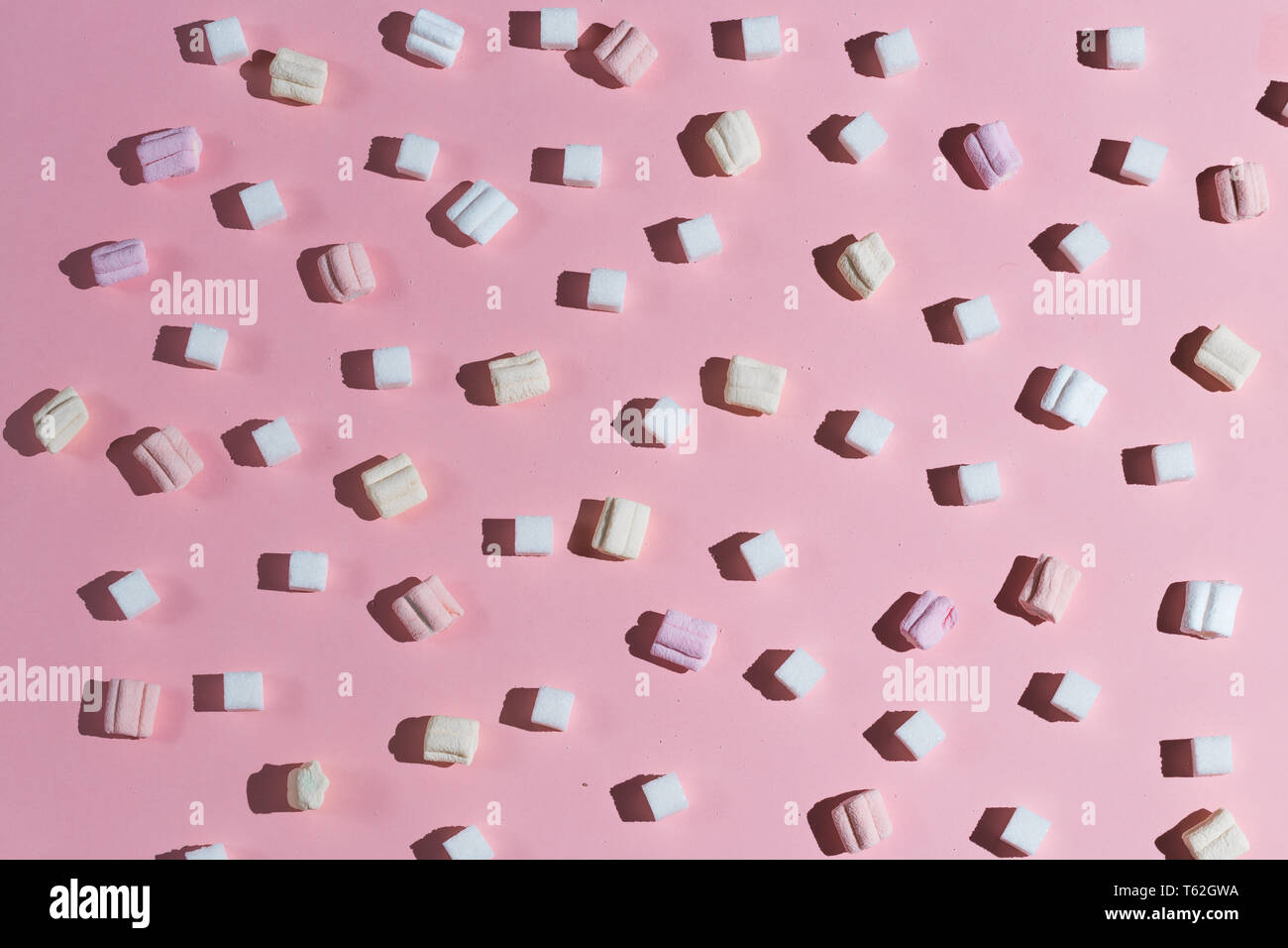 composition of marshmallows and cubes of sugar, treat for sweet tooth ...