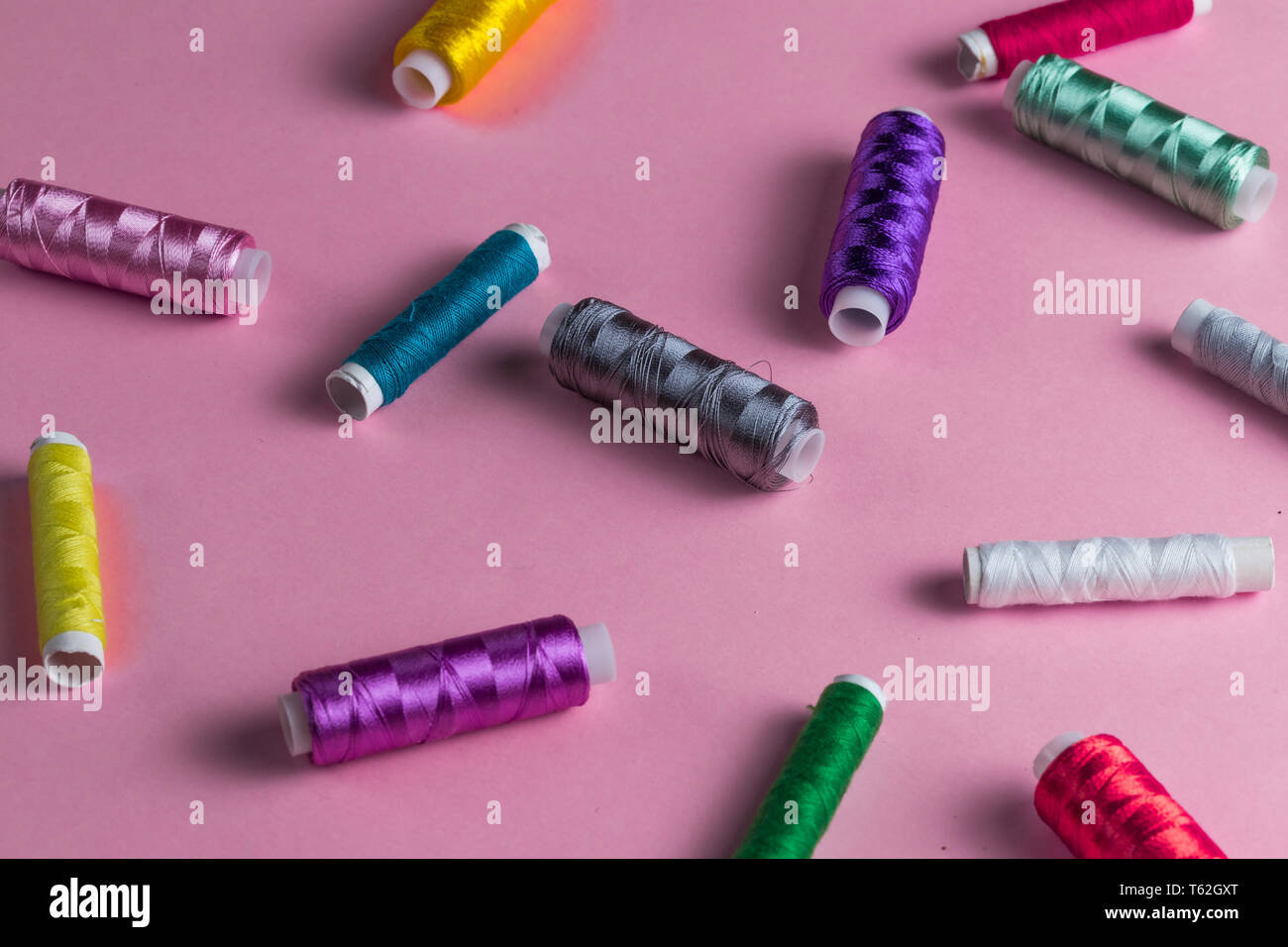 colorful sewing thread coils on the table. tailor's tool. top view ...