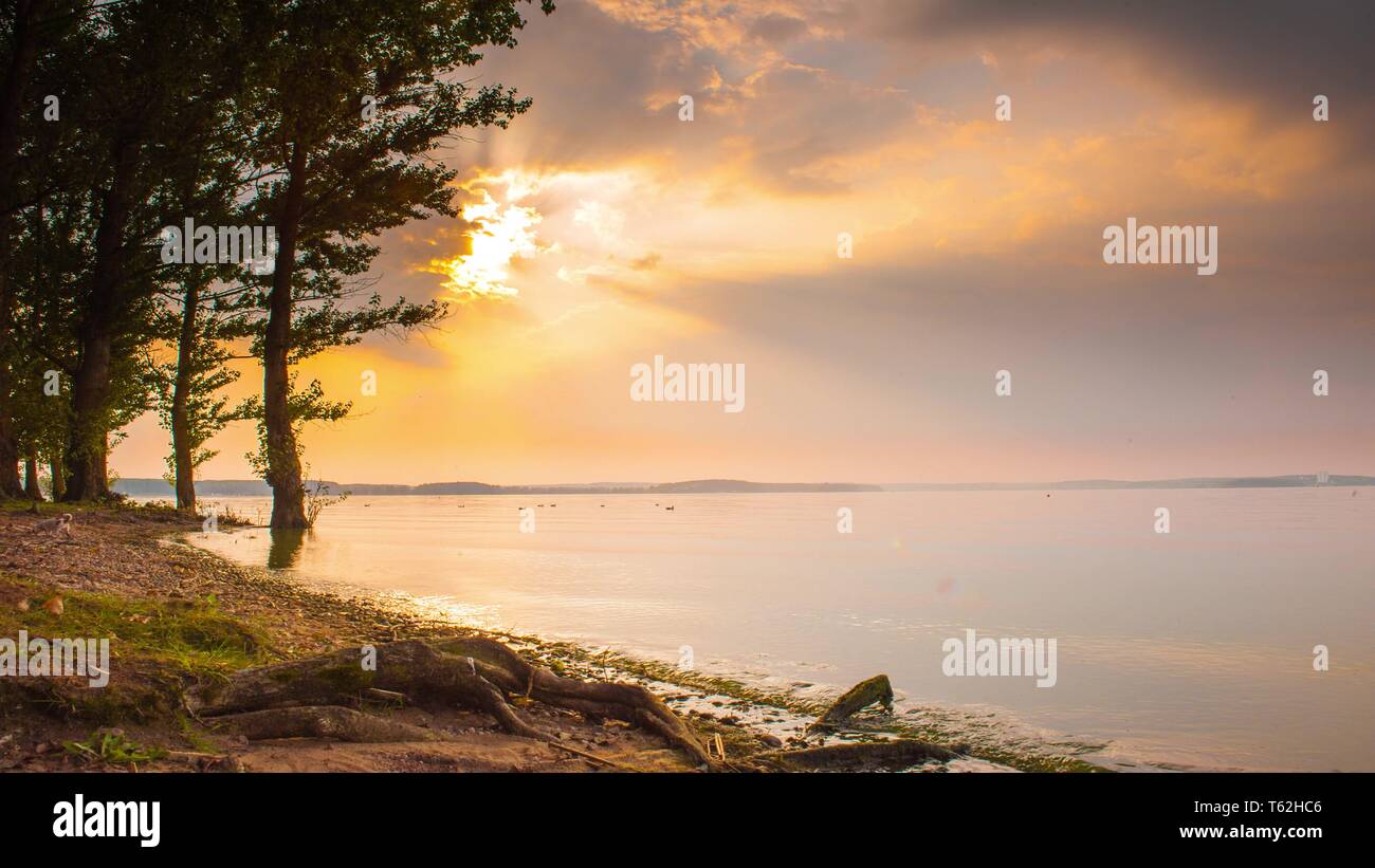 4K sunset beautiful summer landscape with cloudy sky and natural lake ...