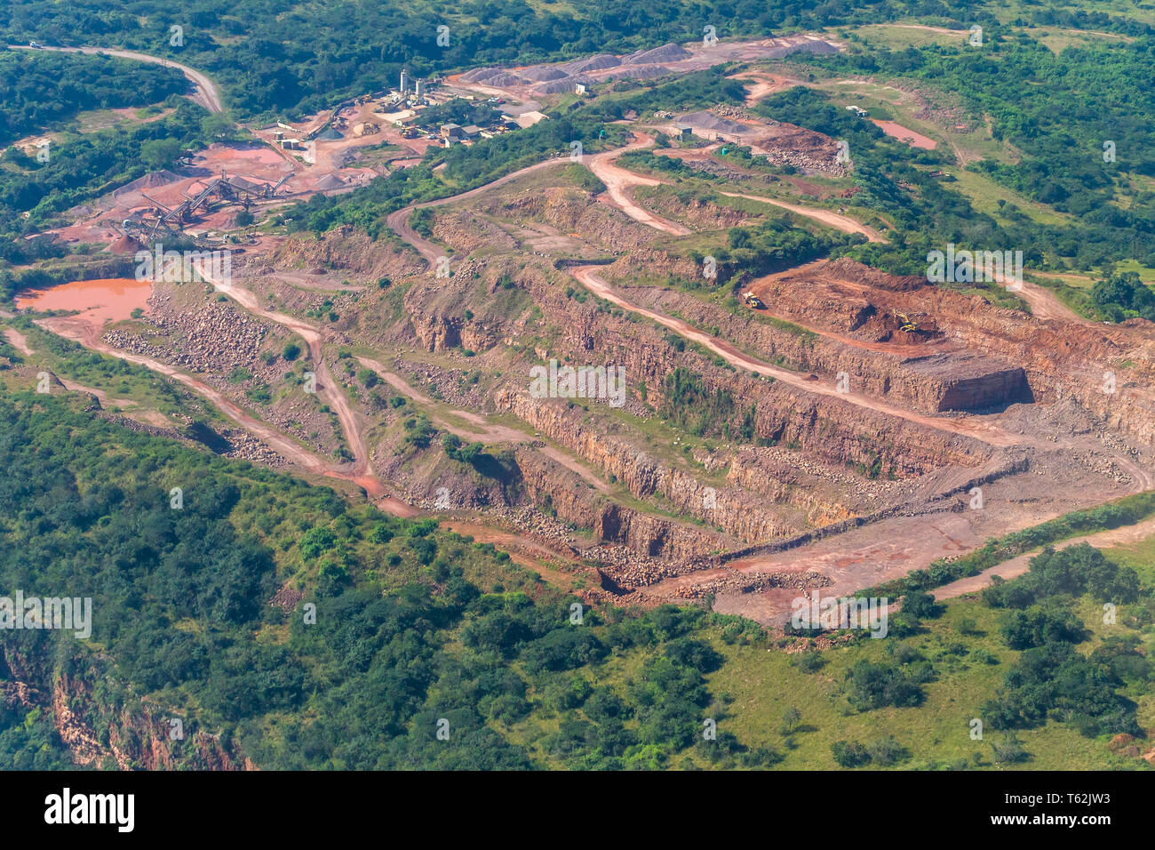 Large open cast stone quarry with industrial trucks conveyors crushing ...