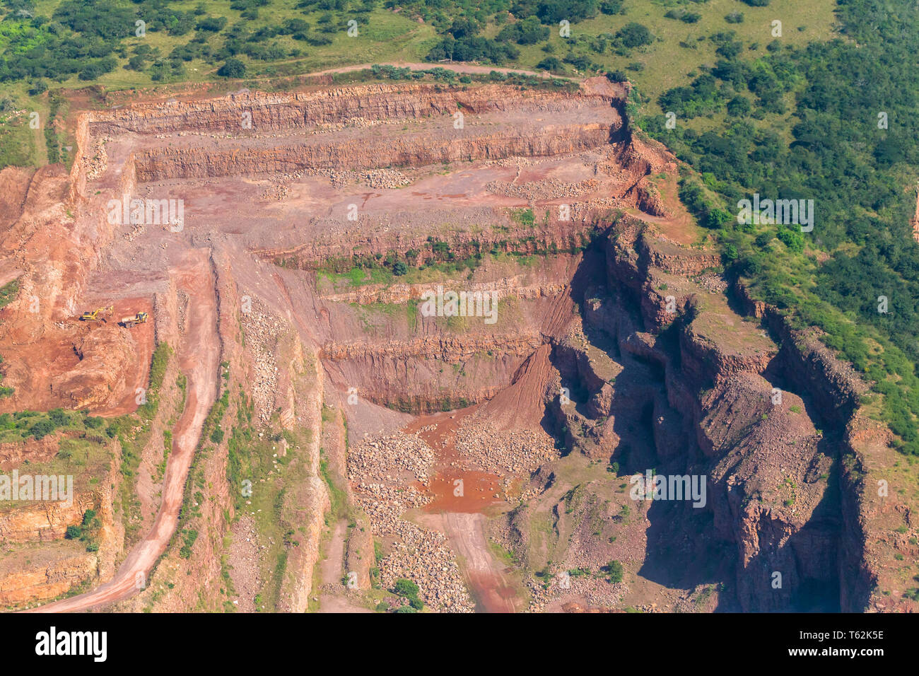 Large open cast stone quarry with industrial trucks conveyors crushing ...
